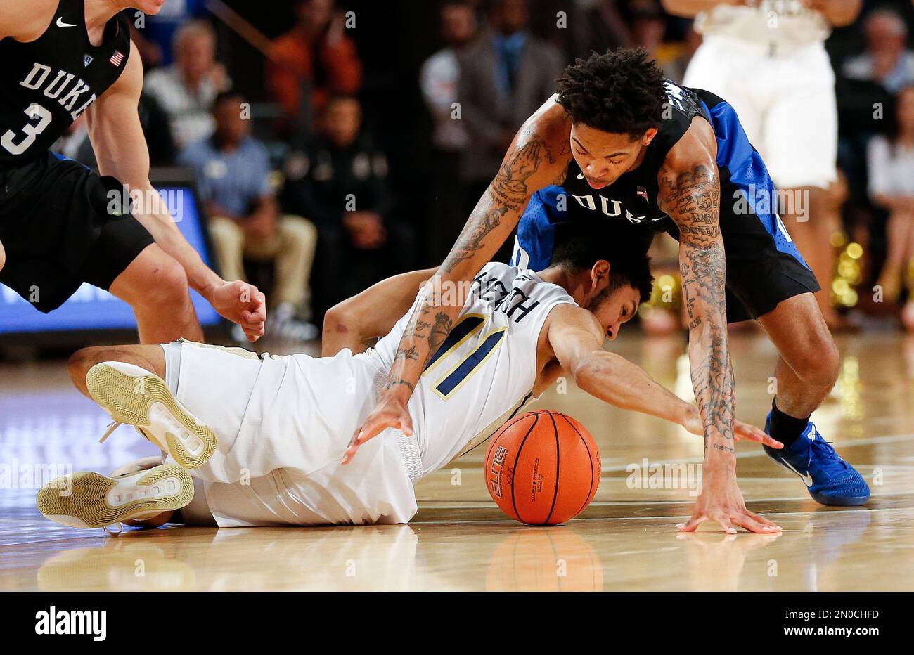 Georgia Tech guard Josh Heath (11) and Duke guard Brandon Ingram vie ...