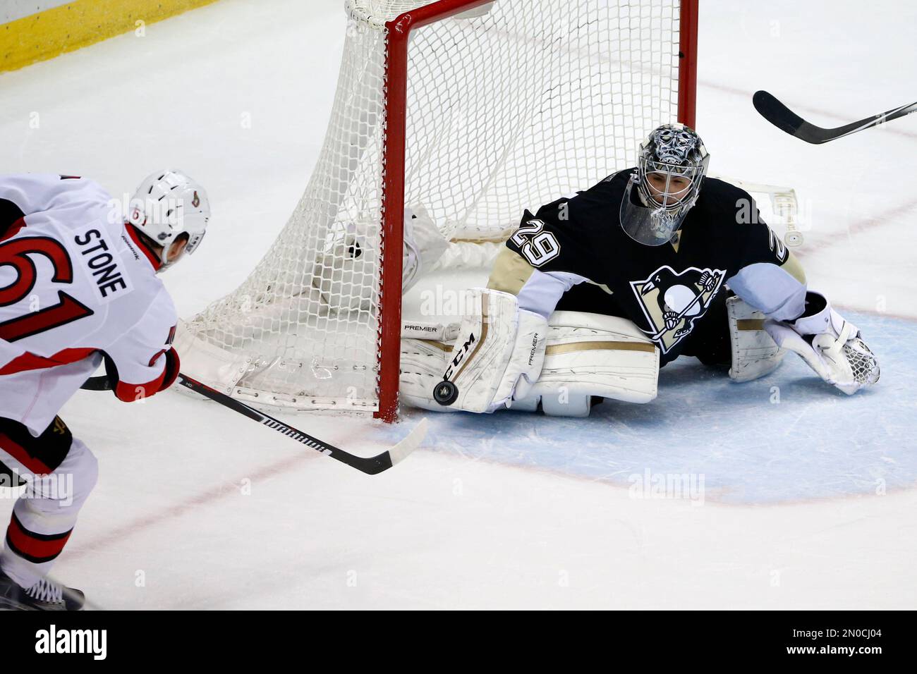 Ottawa Senators' Mark Stone (61) puts the puck past Pittsburgh Penguins ...