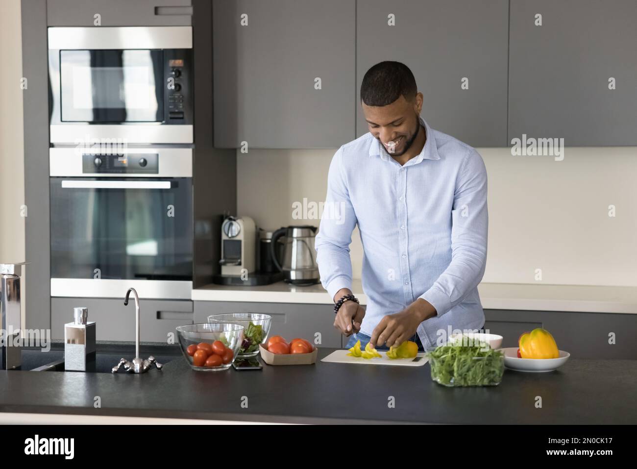 African guy enjoying lunch hi-res stock photography and images - Alamy