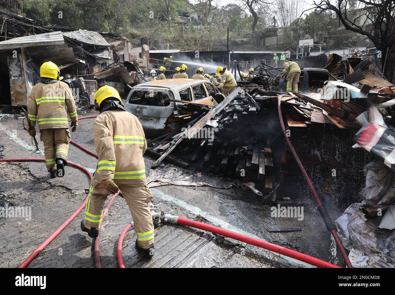 Firefighters rescue at a squatter huts at a village at Wang Lung Tsuen ...