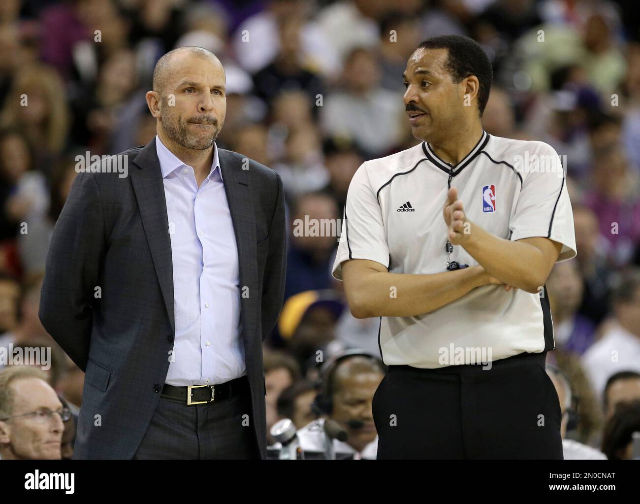 Milwaukee Bucks head coach Jason Kidd, left, discusses call with ...
