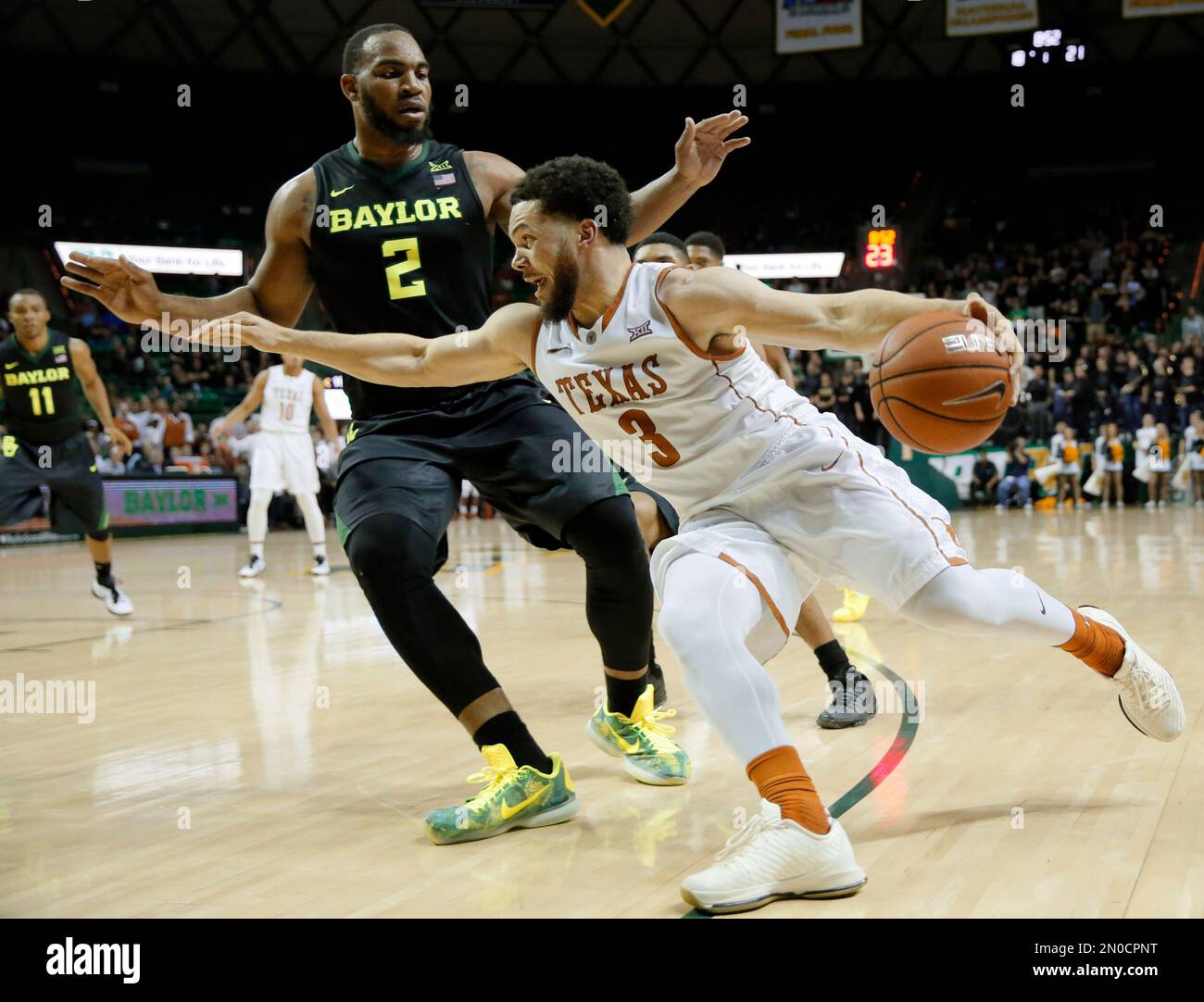 Texas guard Javan Felix (3) drives past Baylor's Rico Gathers (2) on ...