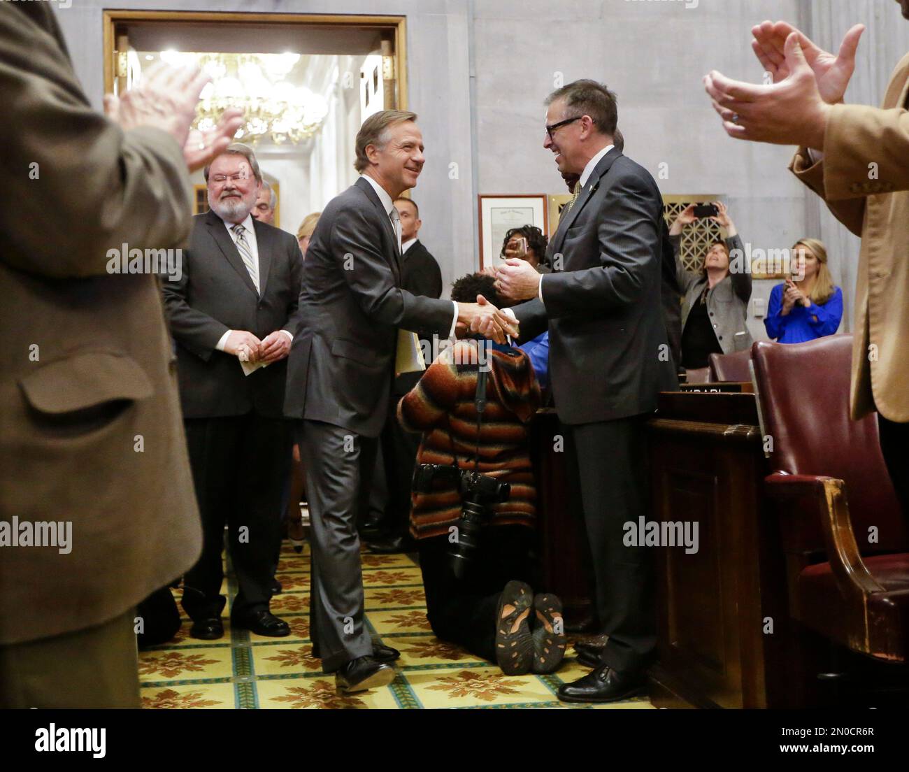 Tennessee Gov. Bill Haslam, center, is greeted as he enters the House ...