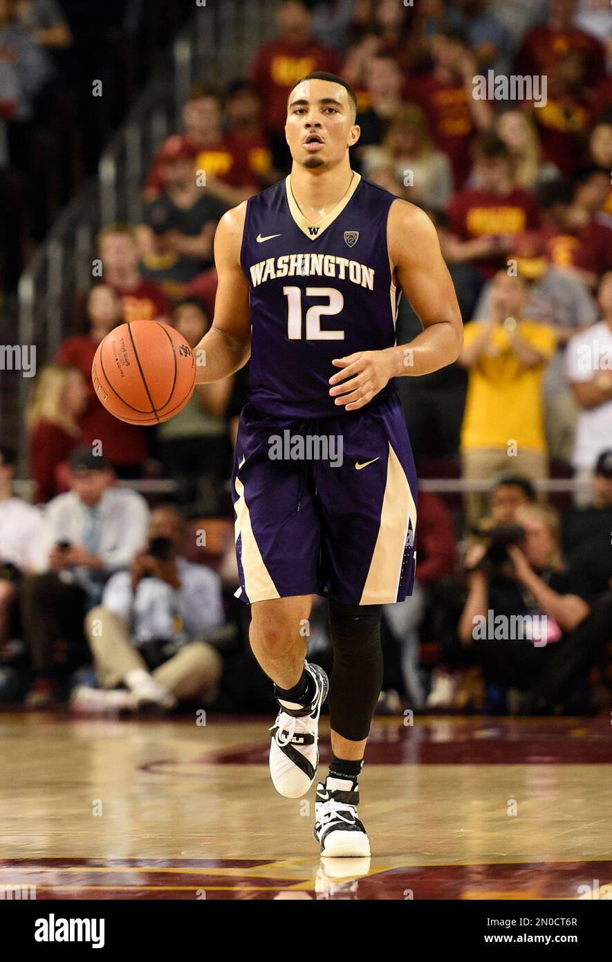 Washington guard Andrew Andrews moves the ball down the court during ...