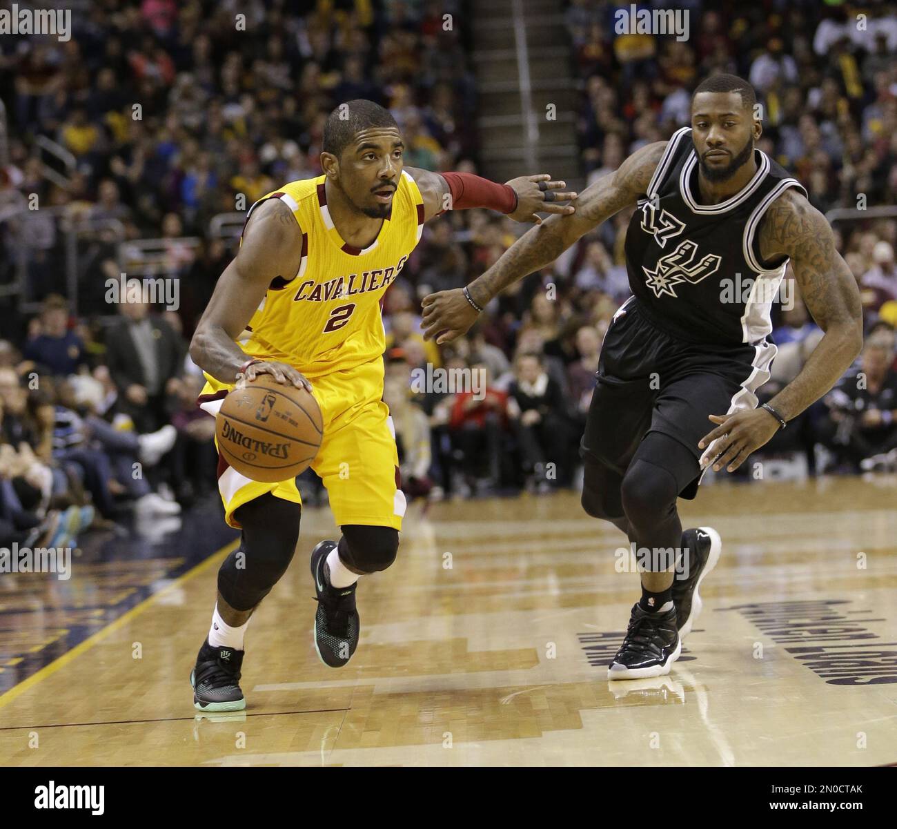 Cleveland Cavaliers' Kyrie Irving (2) drives past San Antonio Spurs ...