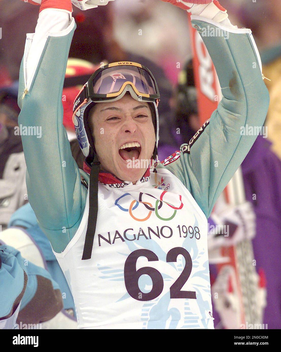 A jubilant Kazuyoshi Funaki, of Japan, winner of the gold medal ...