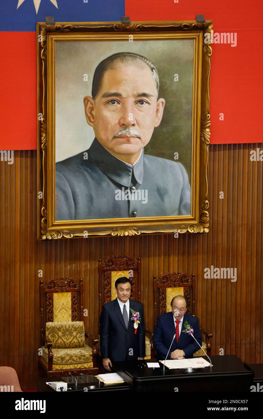 Under a portrait of Dr. Sun Yat-sen, the founding father of the ...