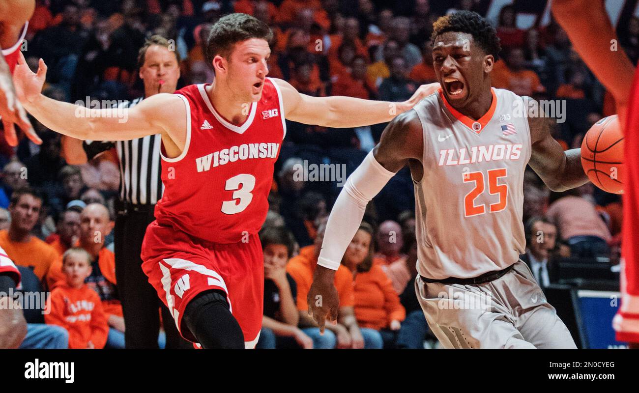 Illinois' guard Kendrick Nunn (25) is guarded by Wisconsin's guard Zak ...