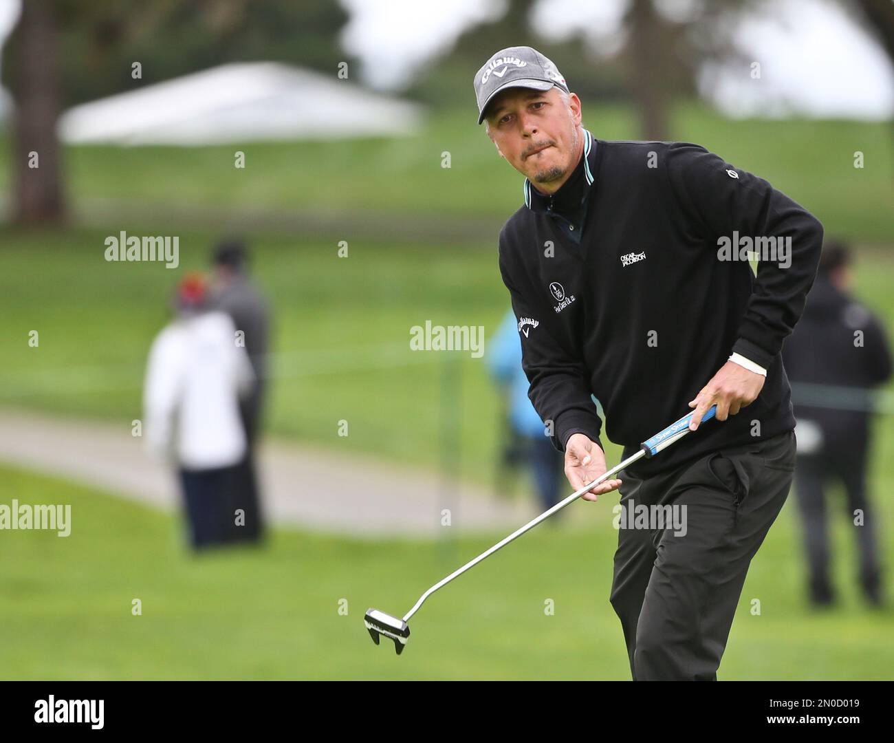Freddie Jacobson watches his eagle attempt while putting on the sixth ...