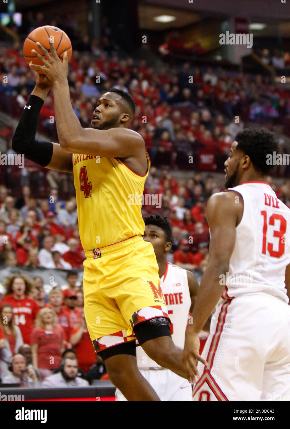Maryland's Robert Carter, left, goes up for a shot against Ohio State's ...