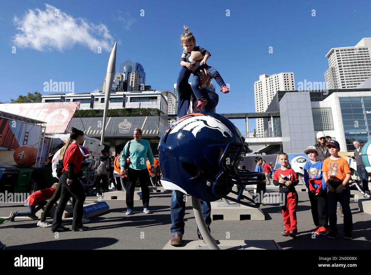 Chad Lynch hoists his 18-month old daughter Charleigh over a Denver ...