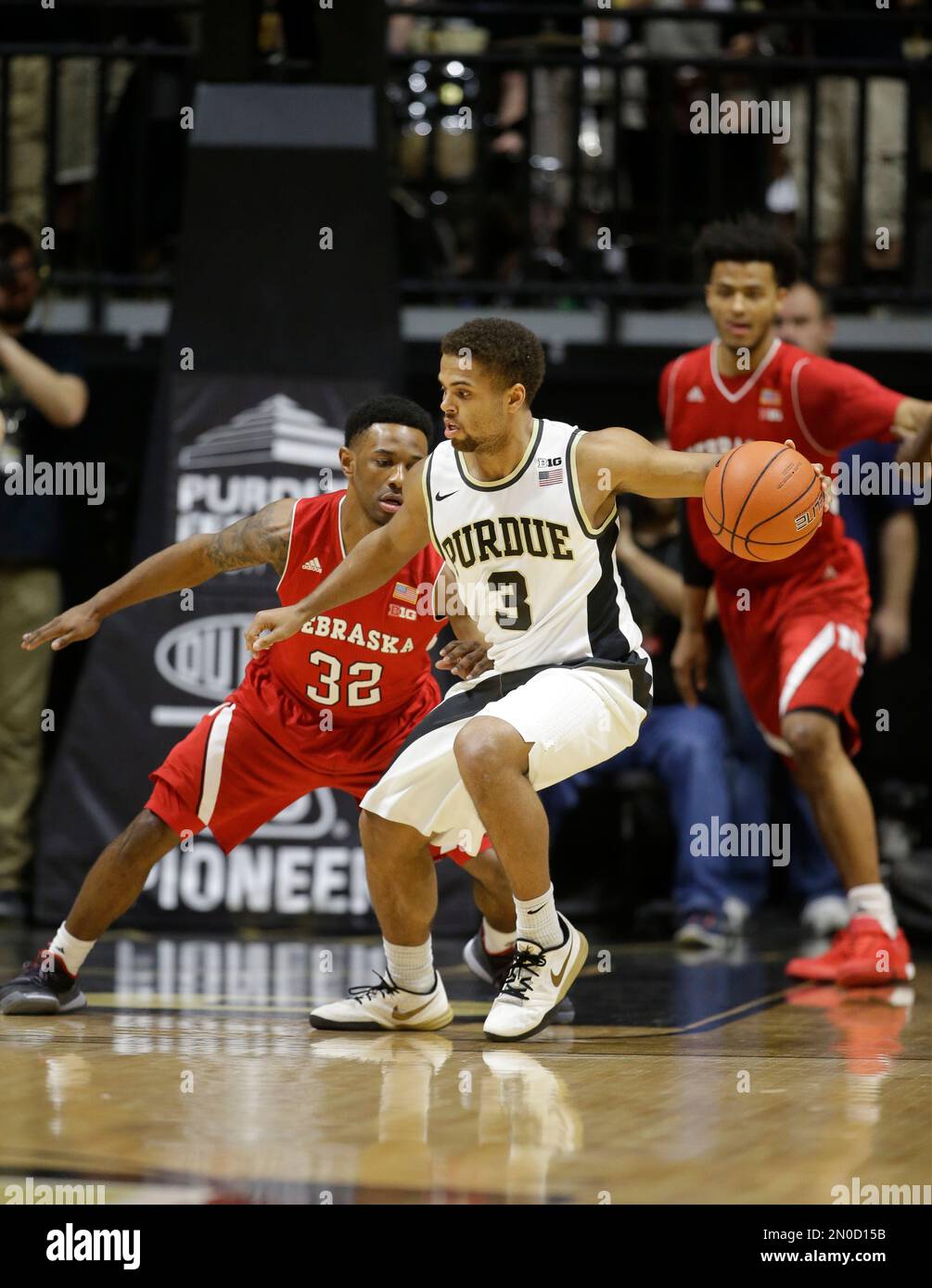 Purdue's P.J. Thompson (3) is defended by Nebraska guard Benny Parker ...