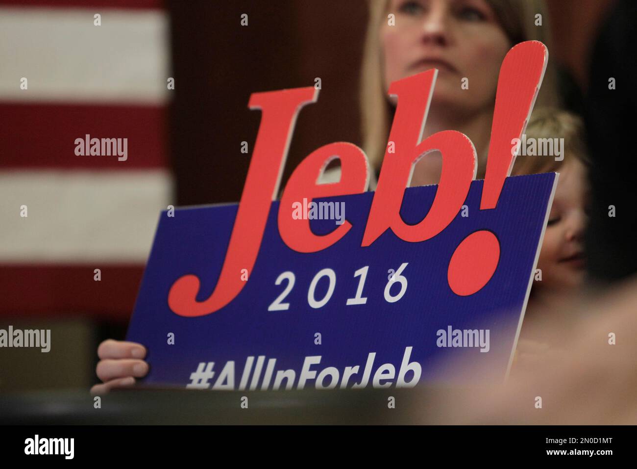 A supporter holds up a sign as Republican presidential candidate ...
