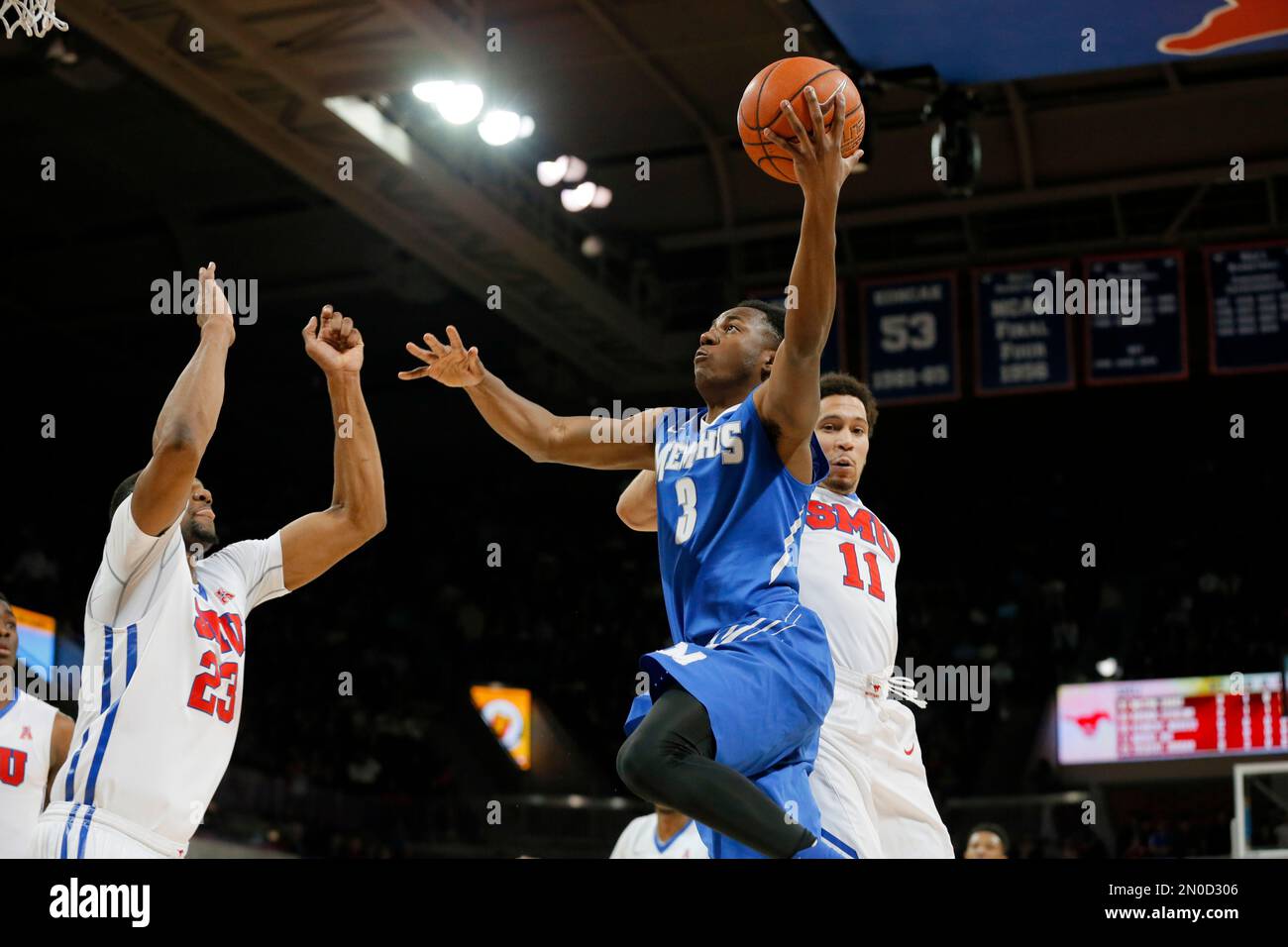 SMU's Jordan Tolbert (23) and Nic Moore (11) defend as Memphis guard ...