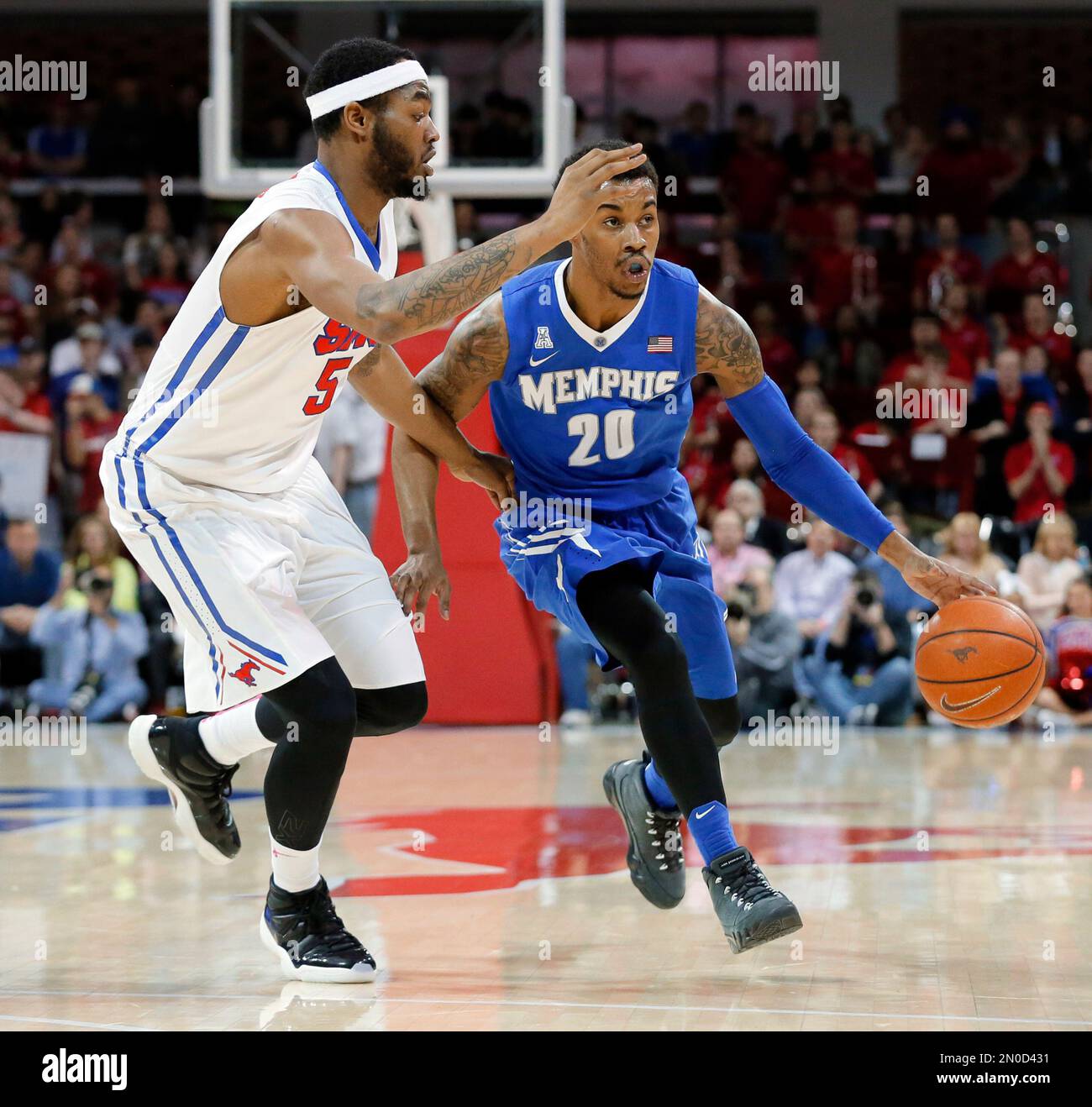 SMU's Markus Kennedy (5) defends as Memphis guard Ricky Tarrant Jr. (20 ...