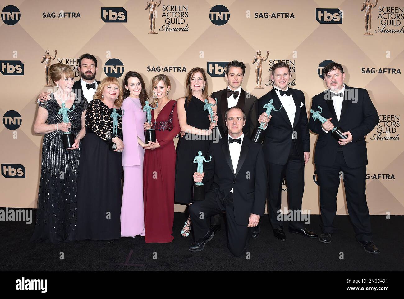 The cast of “Downton Abbey” pose in the press room with their awards ...