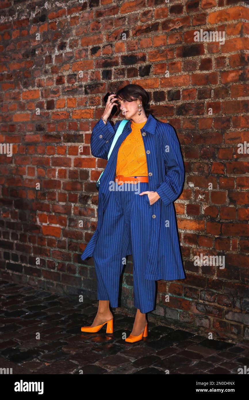 Fashion lover poses before a fashion show of Baum and Pferdgarten brand ...