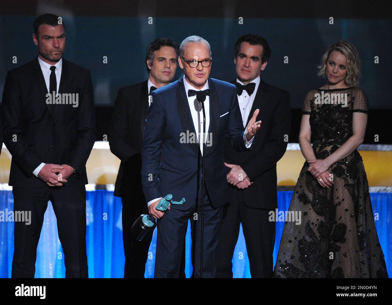 Michael Keaton, foreground, accepts the award for outstanding cast in a ...