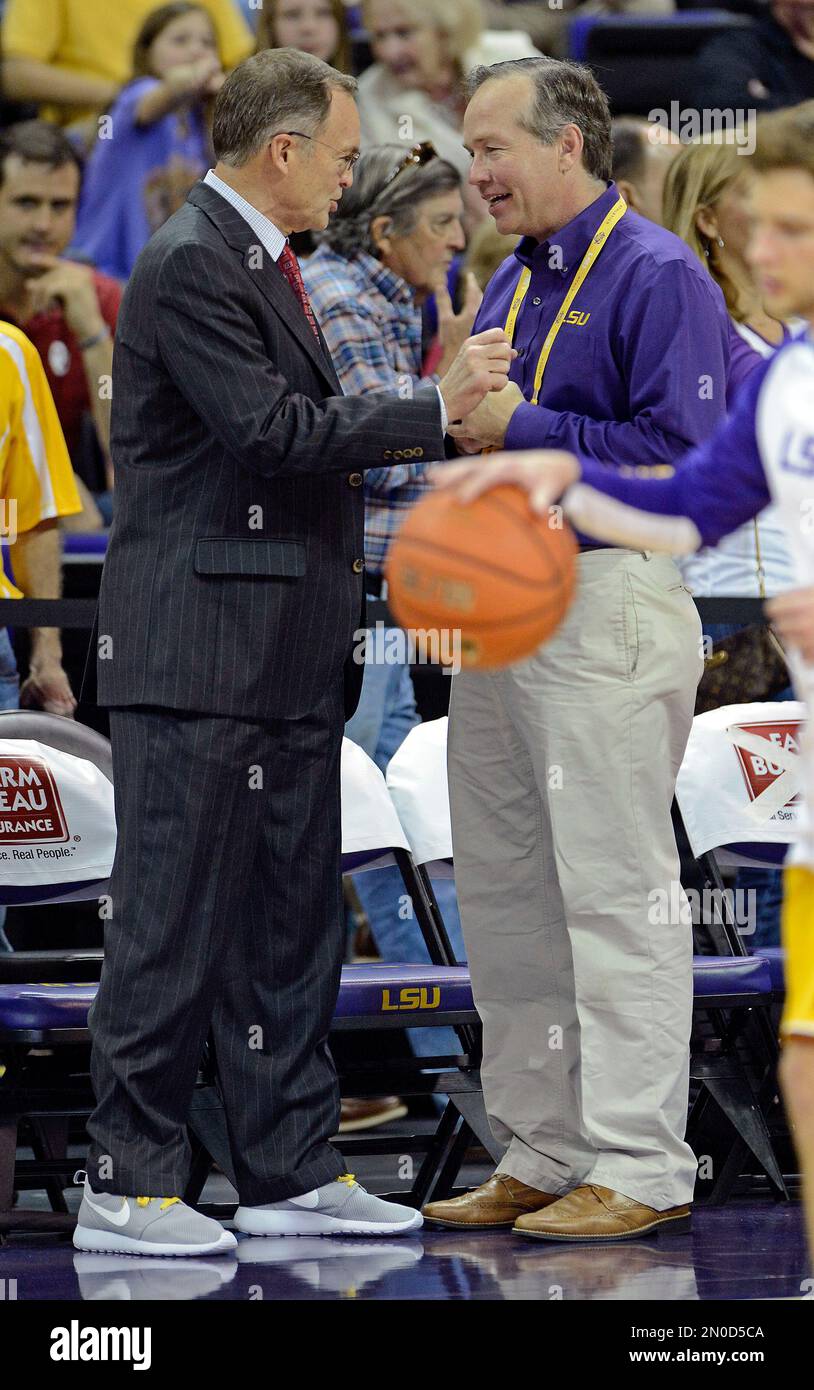 LSU president F. King Alexander, right, chats with Oklahoma head coach ...