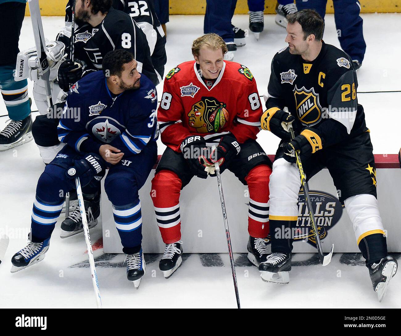 Winnipeg Jets defenseman Dustin Byfuglien, left, Chicago Blackhawks forward Patrick Kane (88 ...