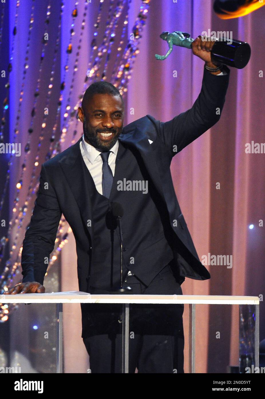 Idris Elba accepts the award for outstanding male actor in a TV movie ...