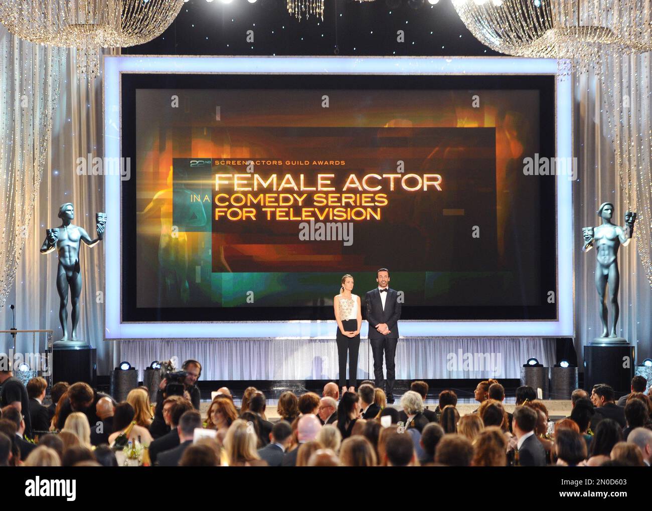 Kristen Wiig, left, and Jon Hamm present the award for outstanding ...