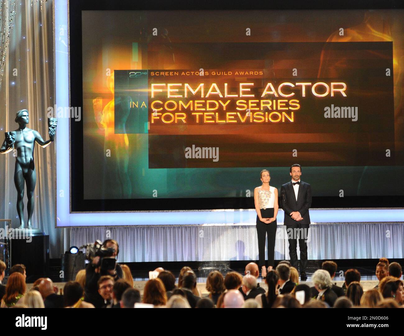 Kristen Wiig, left, and Jon Hamm present the award for outstanding ...