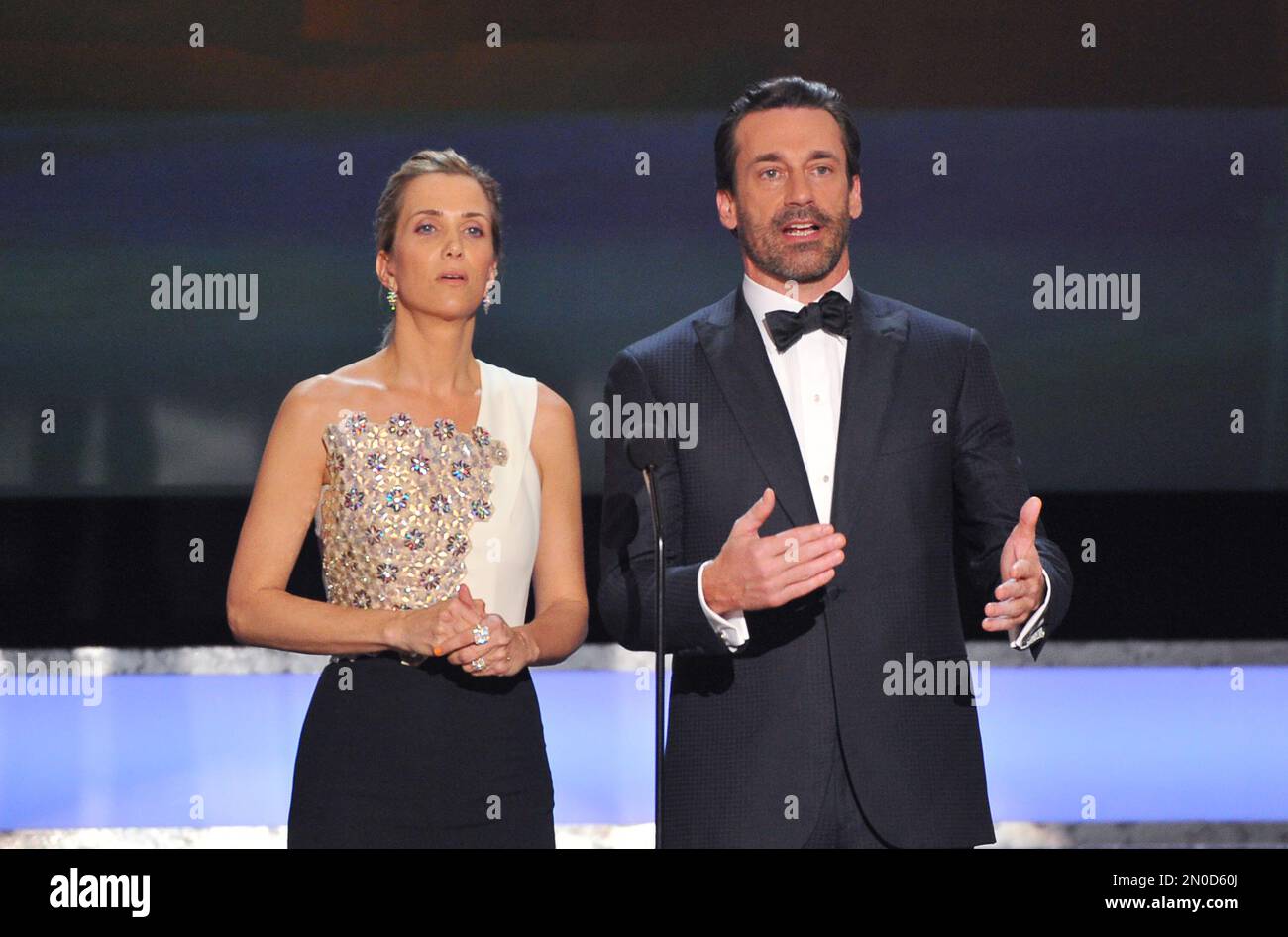 Kristen Wiig, left, and Jon Hamm present the award for outstanding ...