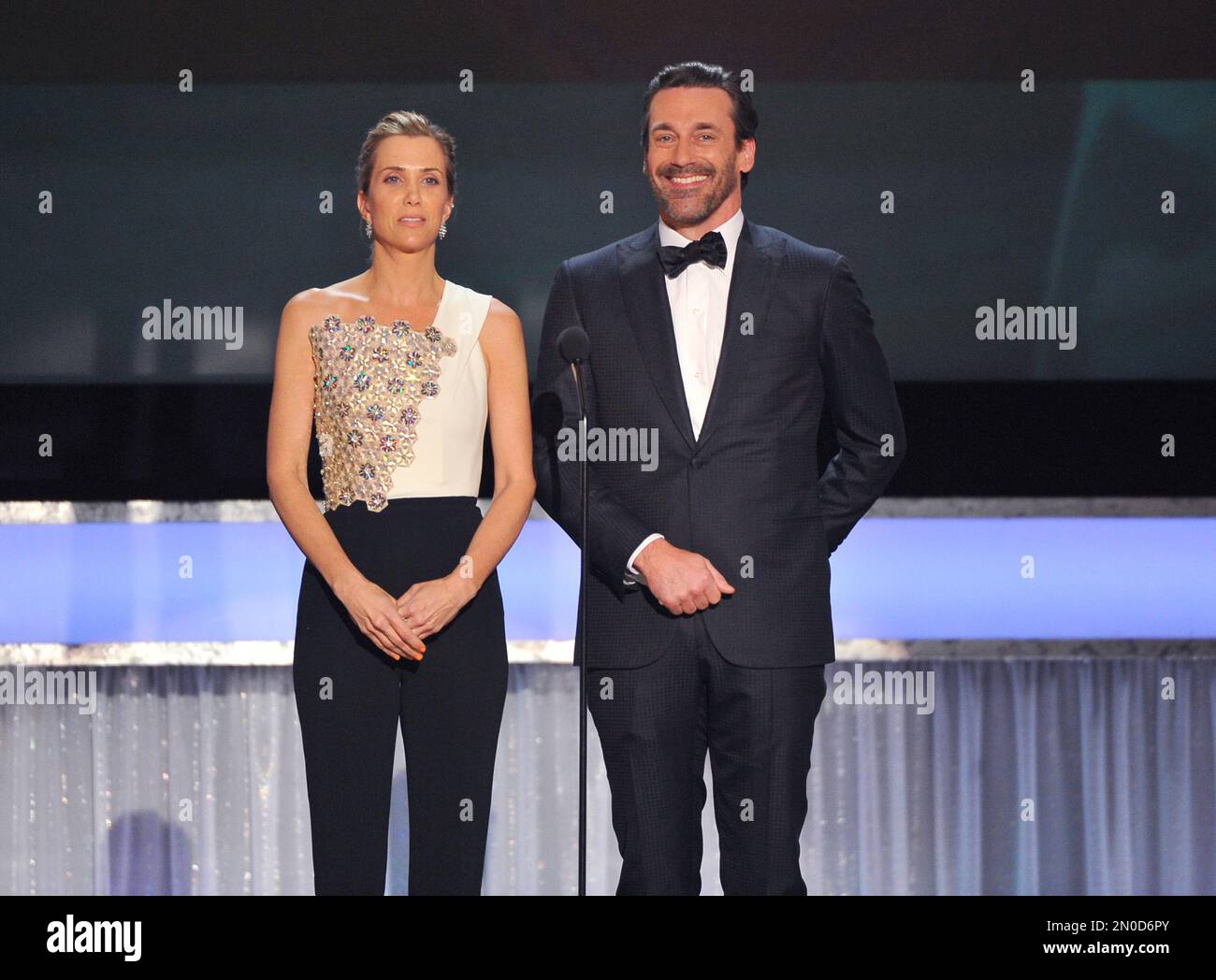 Kristen Wiig, left, and Jon Hamm present the award for outstanding ...