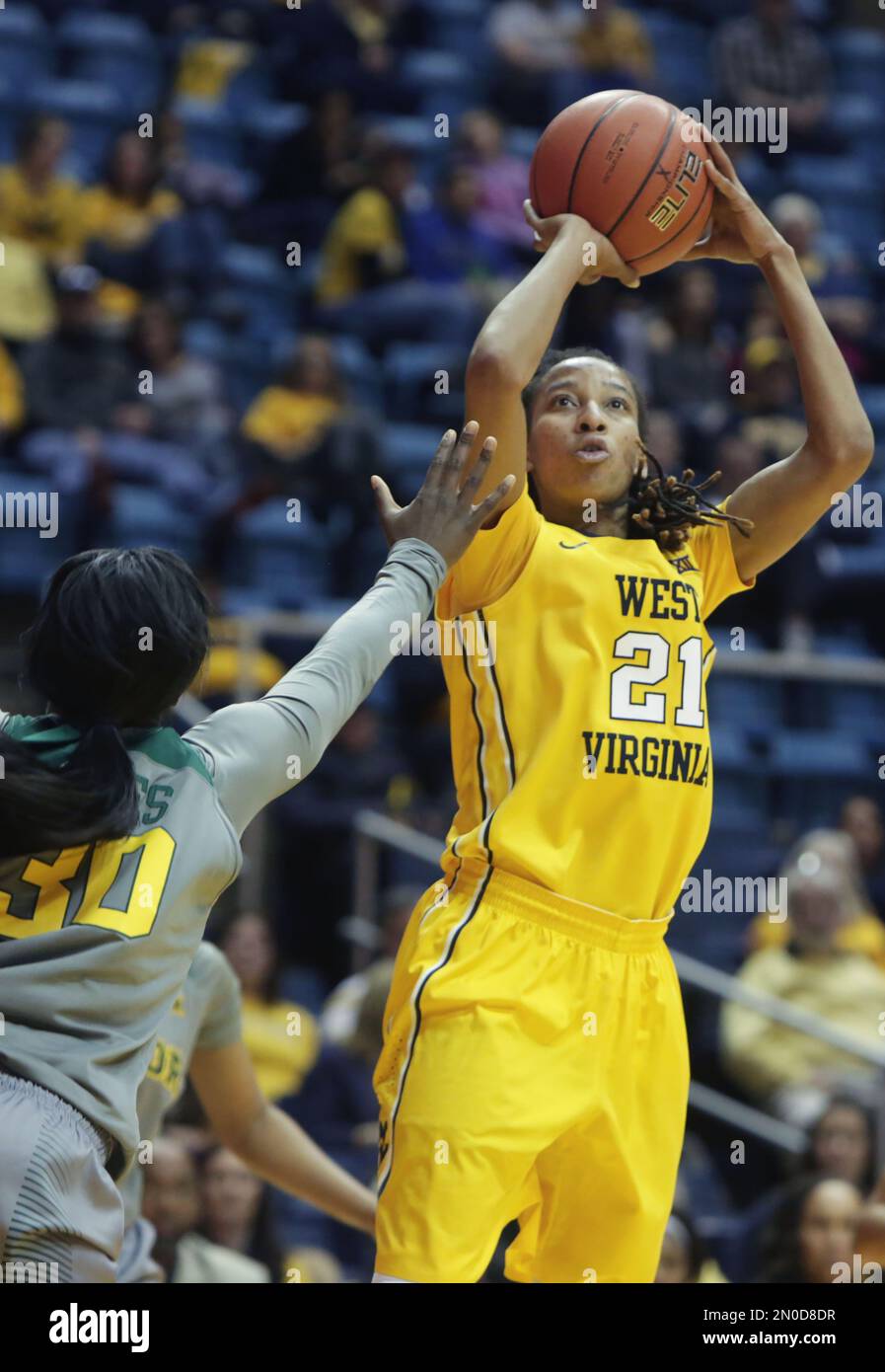 West Virginia guard Jessica Morton (21) takes a shot while being ...