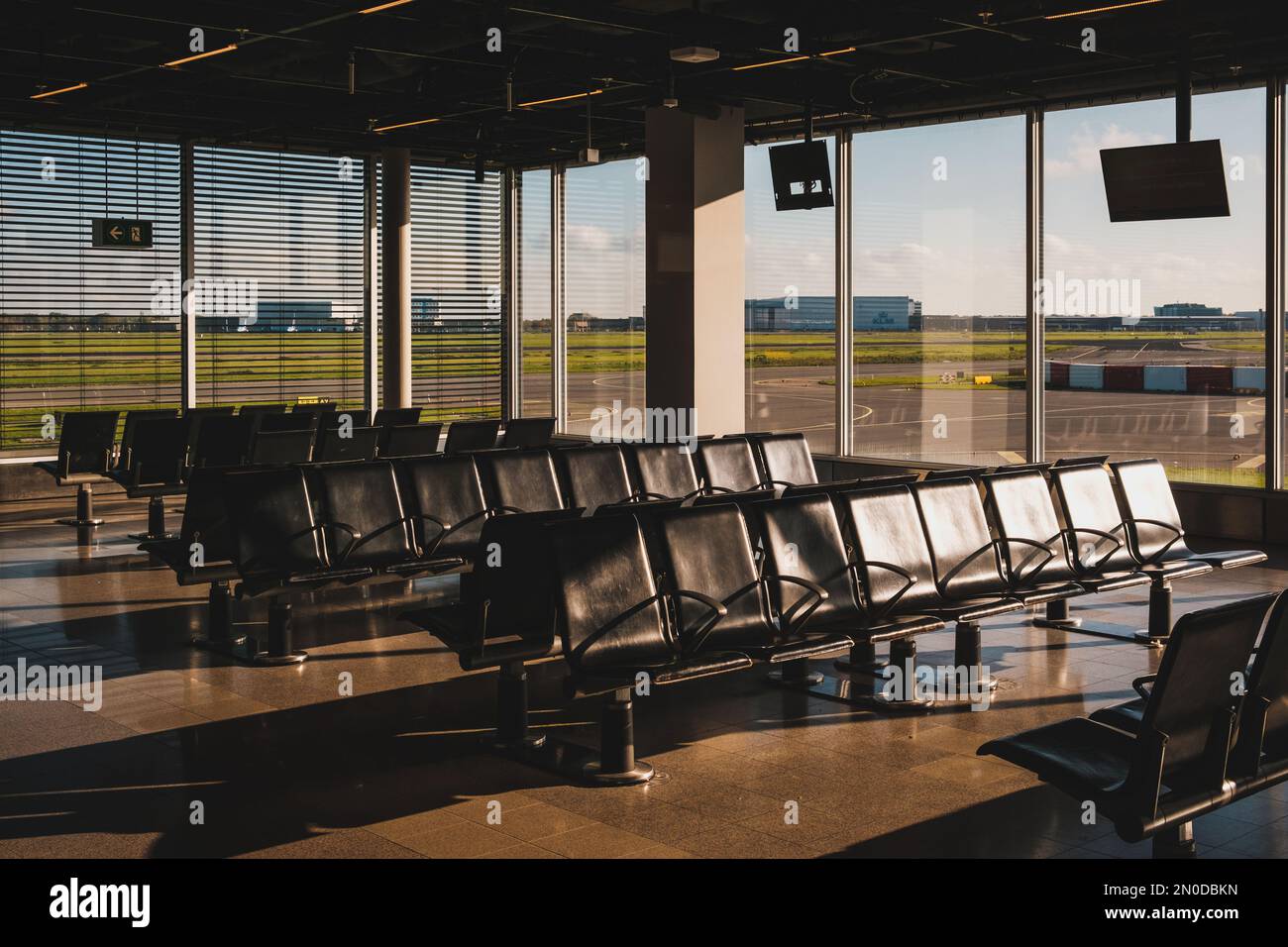 empty airport lounge with runway view windows Stock Photo - Alamy