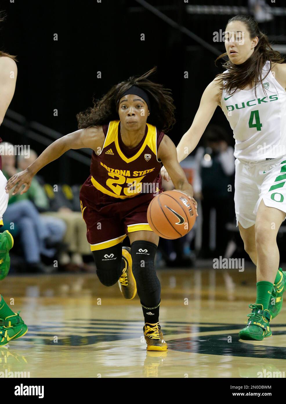 Arizona State's Elisha Davis, left, dribbles down the court next to ...