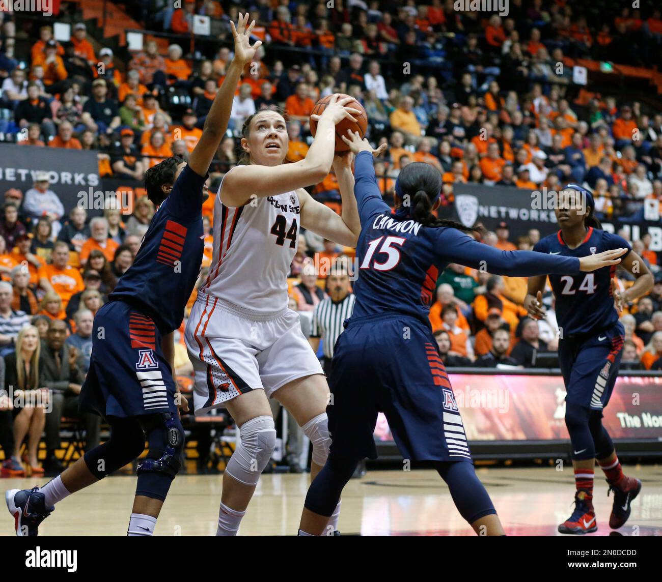 Oregon State's Ruth Hamblin, center, goes to the basket while guarded ...