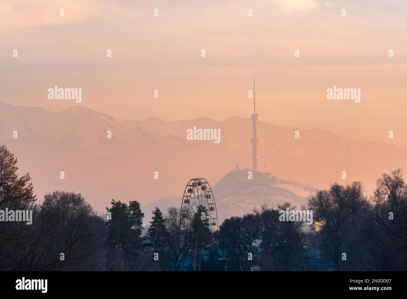 winter sunset view from city park to Koktobe mountain with TV tower in ...