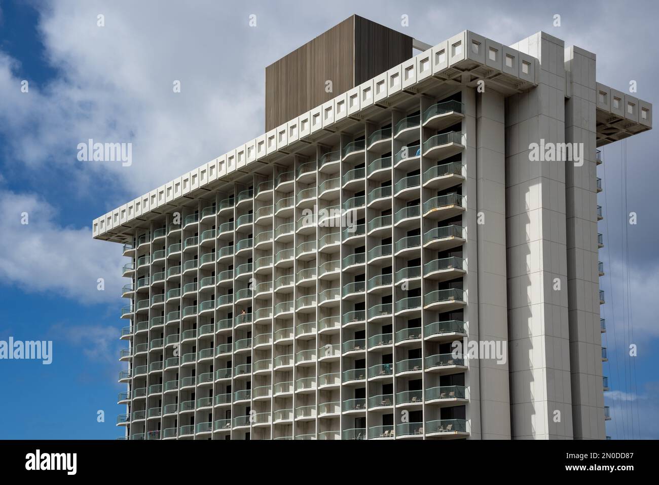 A tall hotel building under a blue sky with clouds in Hawaii, United ...