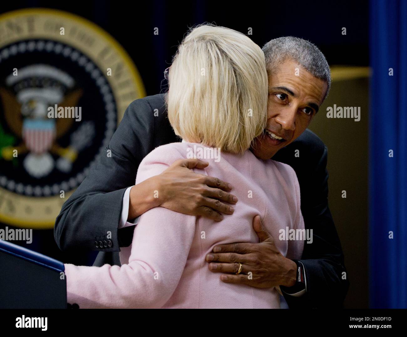 President Barack Obama hugs women's rights activist Lilly Ledbetter, in ...