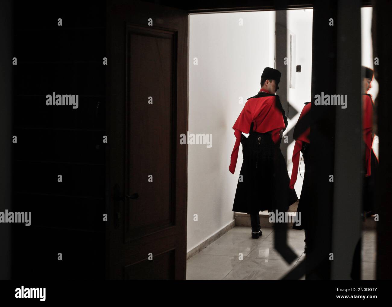 In this Monday, Jan. 11, 2016 photo, a Circassian guard, reflected in a ...