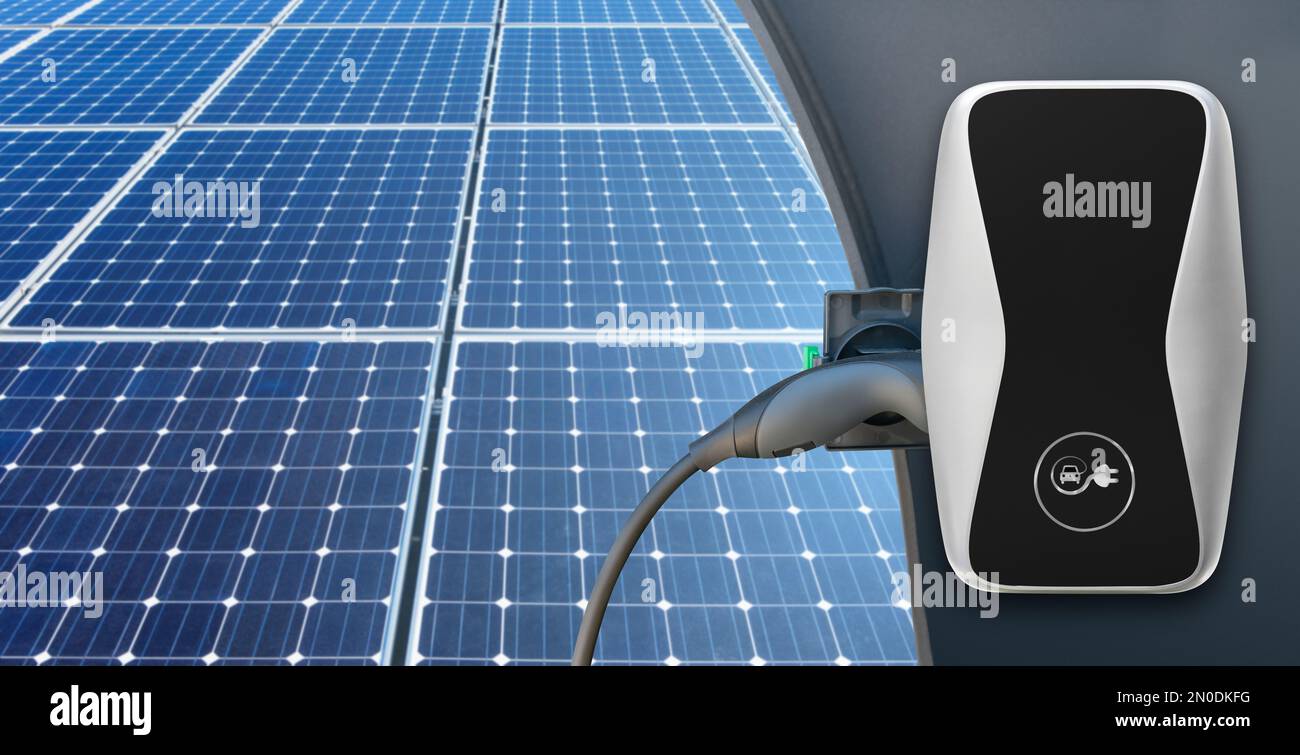 Close up of electric car charging station on the background of solar ...
