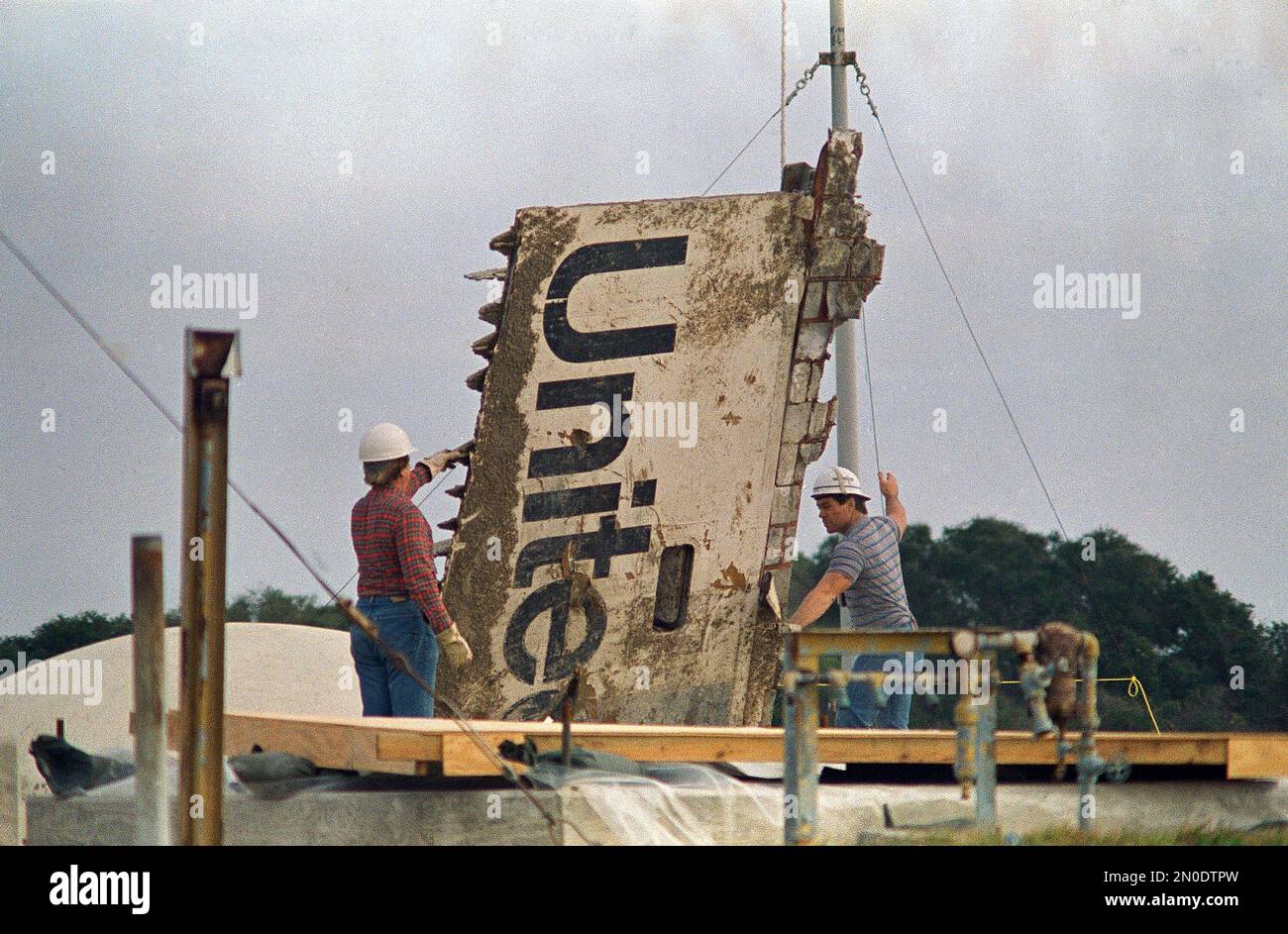 FILE - In this 1986 file photo, workers transport debris from the space ...