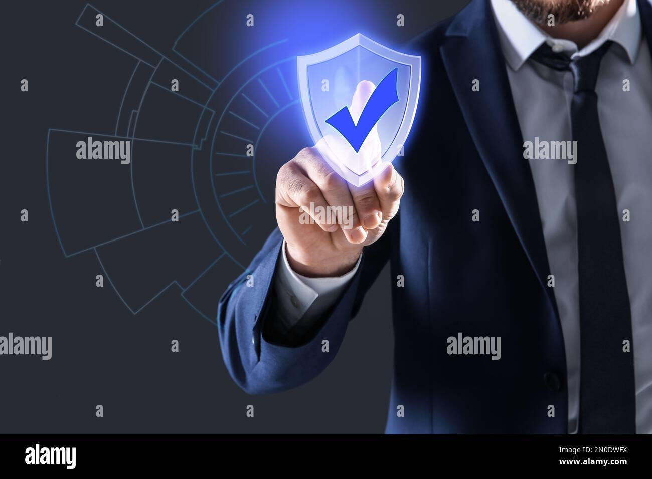 Cyber insurance concept. Man using virtual screen with shield ...