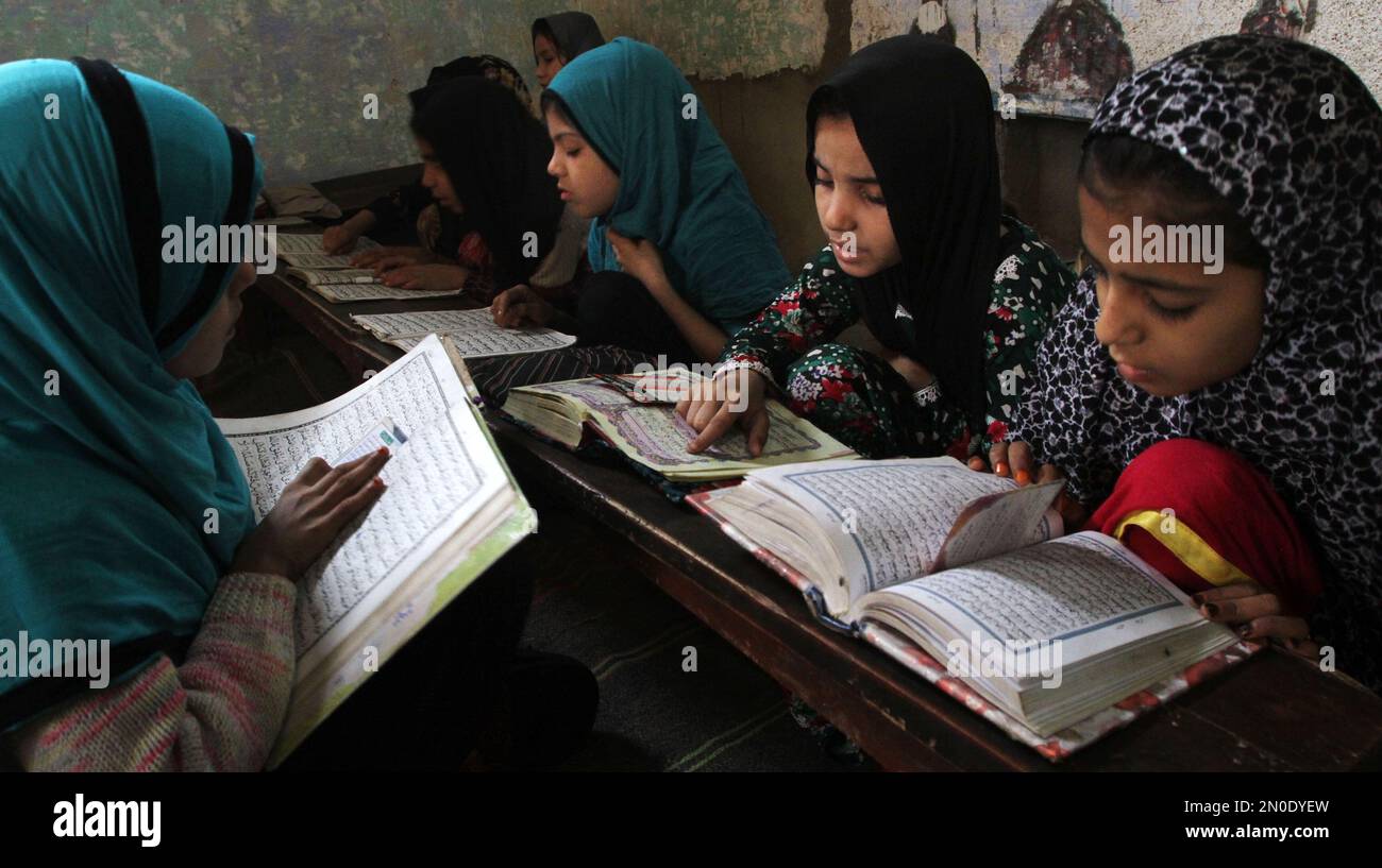 Pakistani girls read the Quran, Islam's holy book, at a local madrassa ...