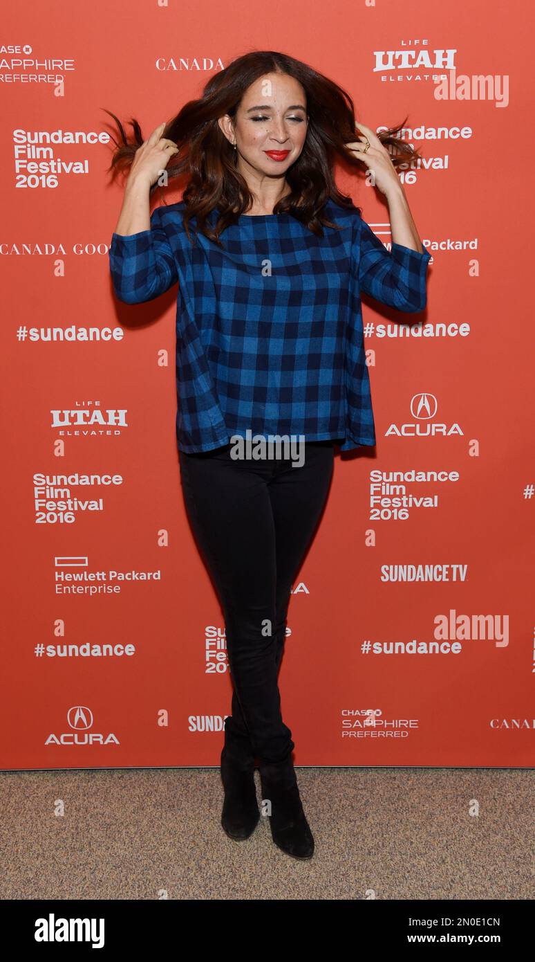 Maya Rudolph, a cast member in "Mr. Pig," primps herself before posing for photographers at the ...