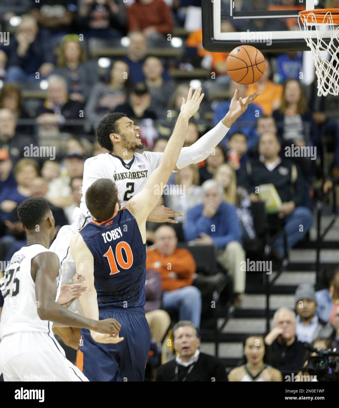 Wake Forest's Devin Thomas (2) drives past Virginia's Mike Tobey (10 ...