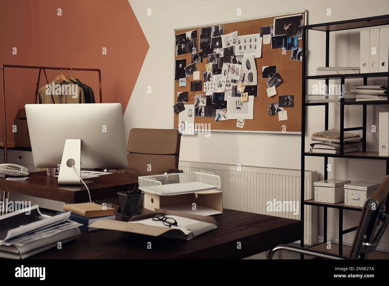 Modern detective office with computer and board Stock Photo - Alamy