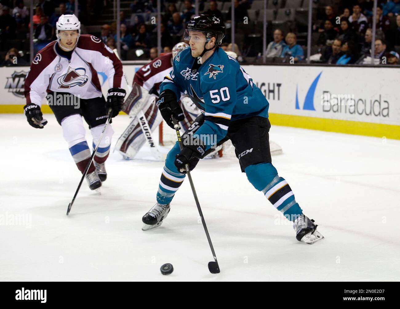 San Jose Sharks' Chris Tierney (50) controls the puck in front of ...