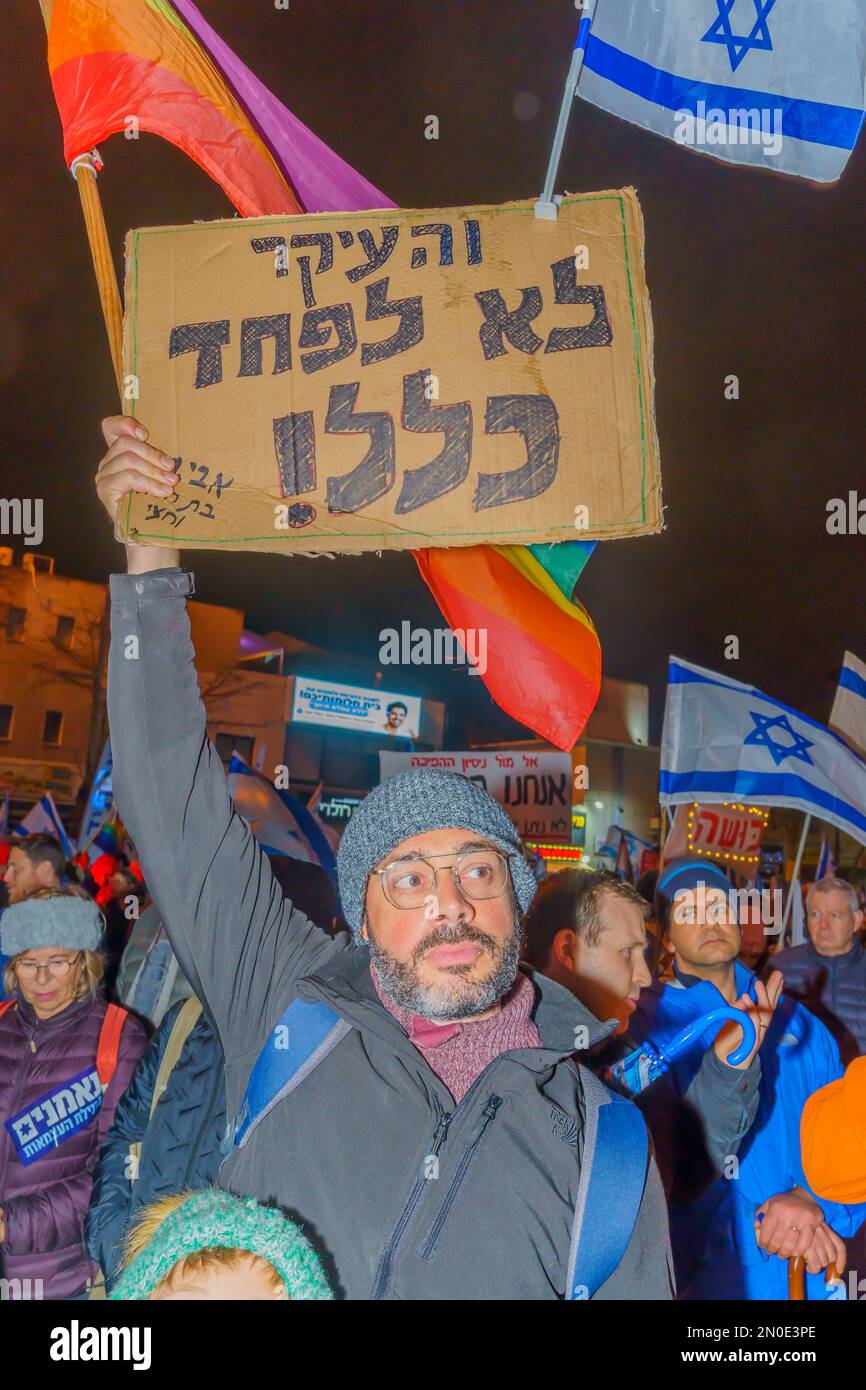 Haifa, Israel - February 04, 2023: Protesters with various signs and ...