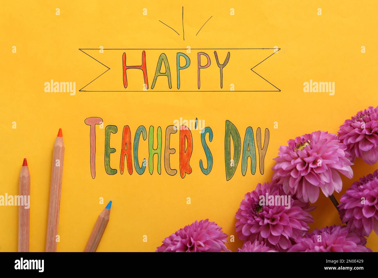 Flat lay composition with words HAPPY TEACHER'S DAY, flowers and ...