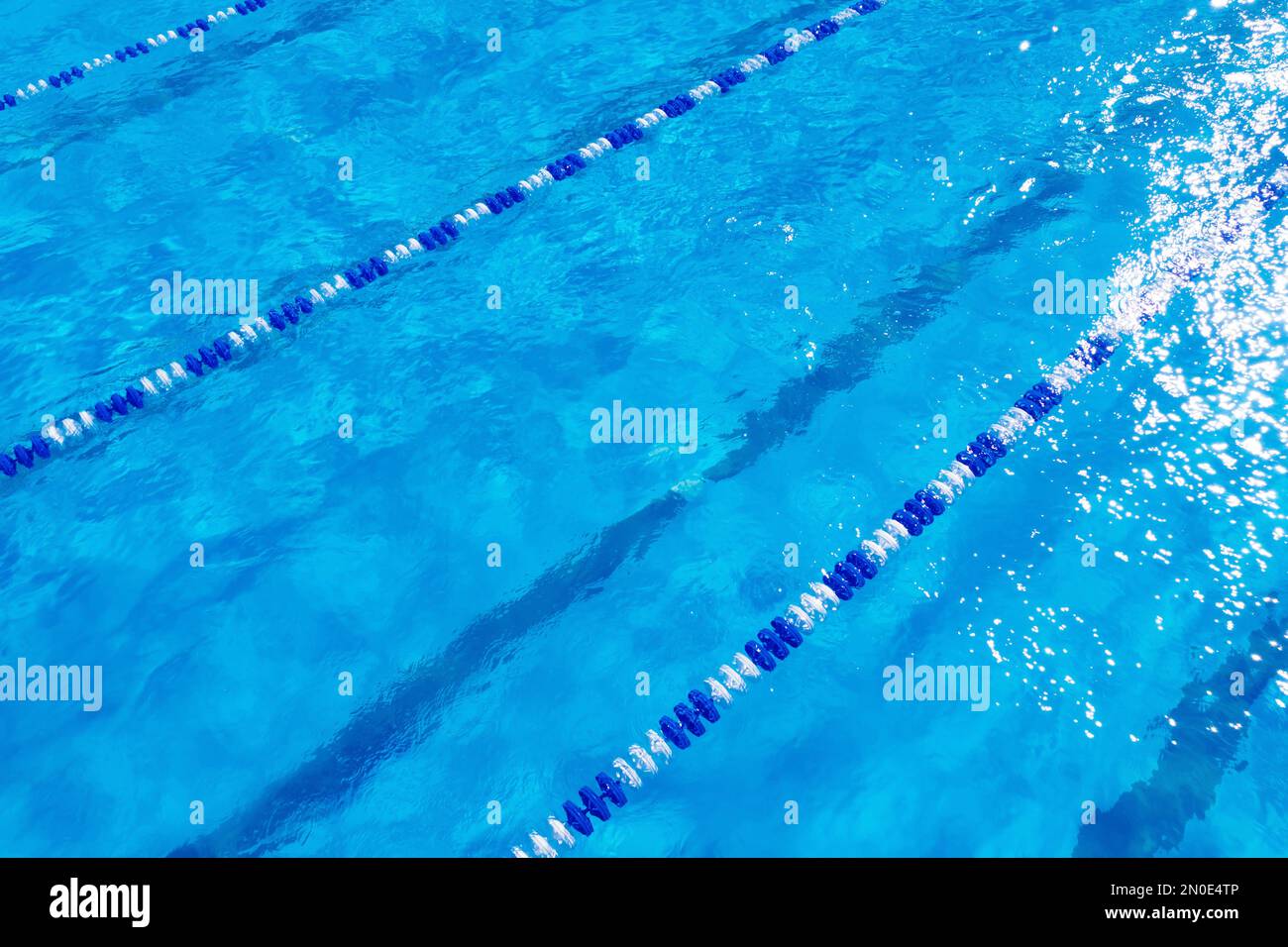 Swimming pool with racing lane dividers, closeup view Stock Photo - Alamy