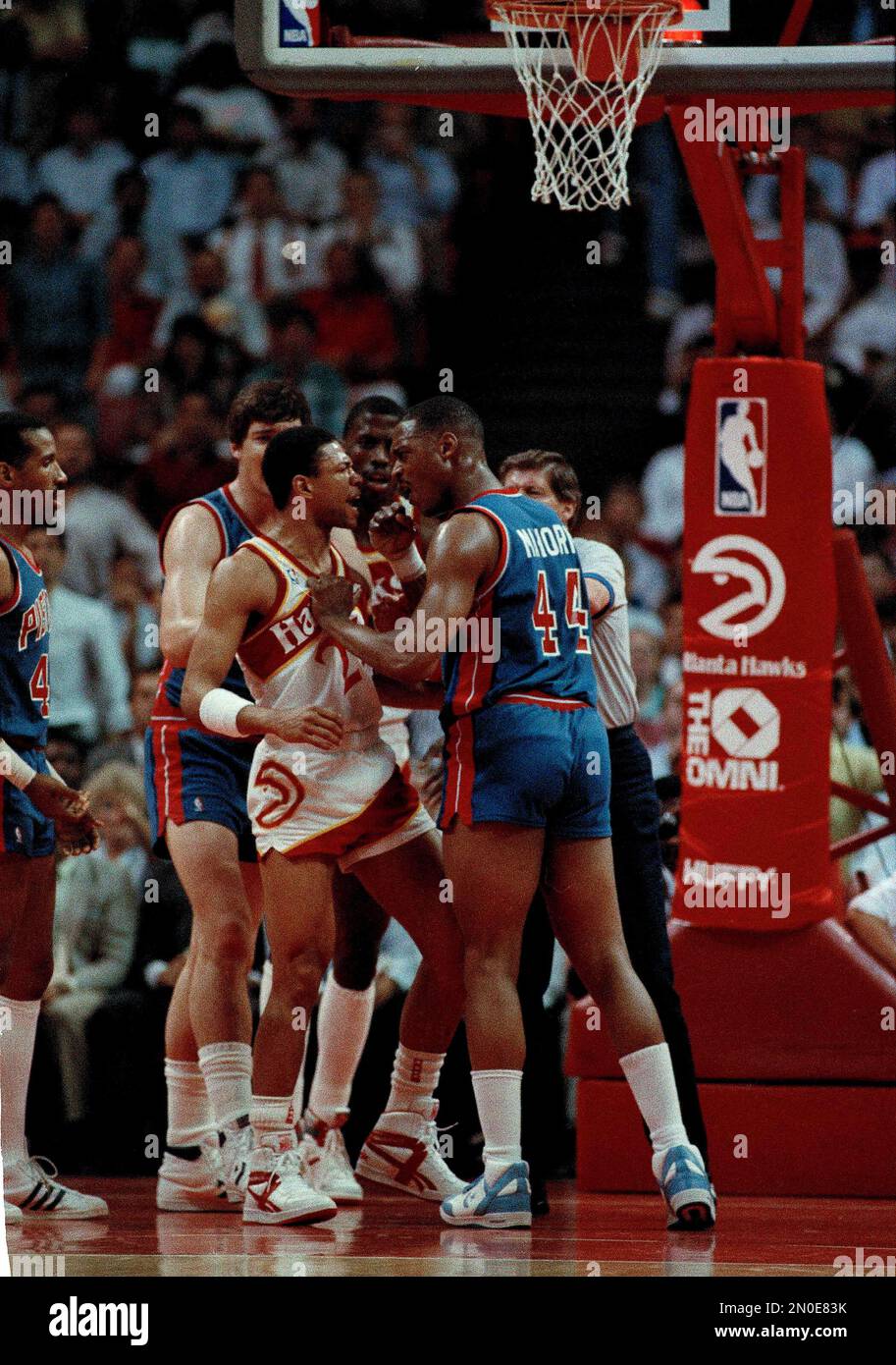 Atlanta Hawks guard Glenn Rivers, left, is shoved by Detroit Pistons ...