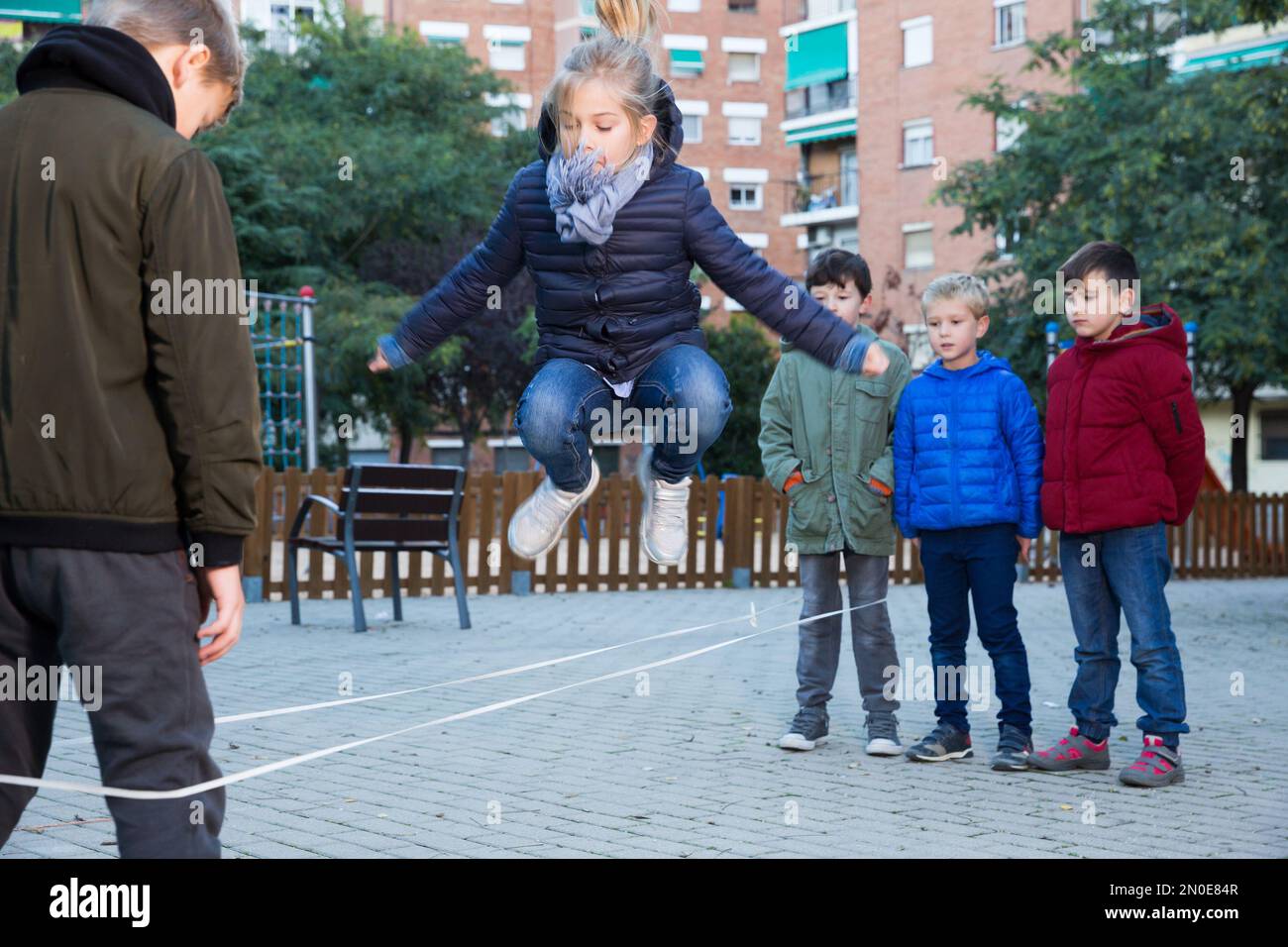 Kids skipping on chinese jump rope Stock Photo - Alamy